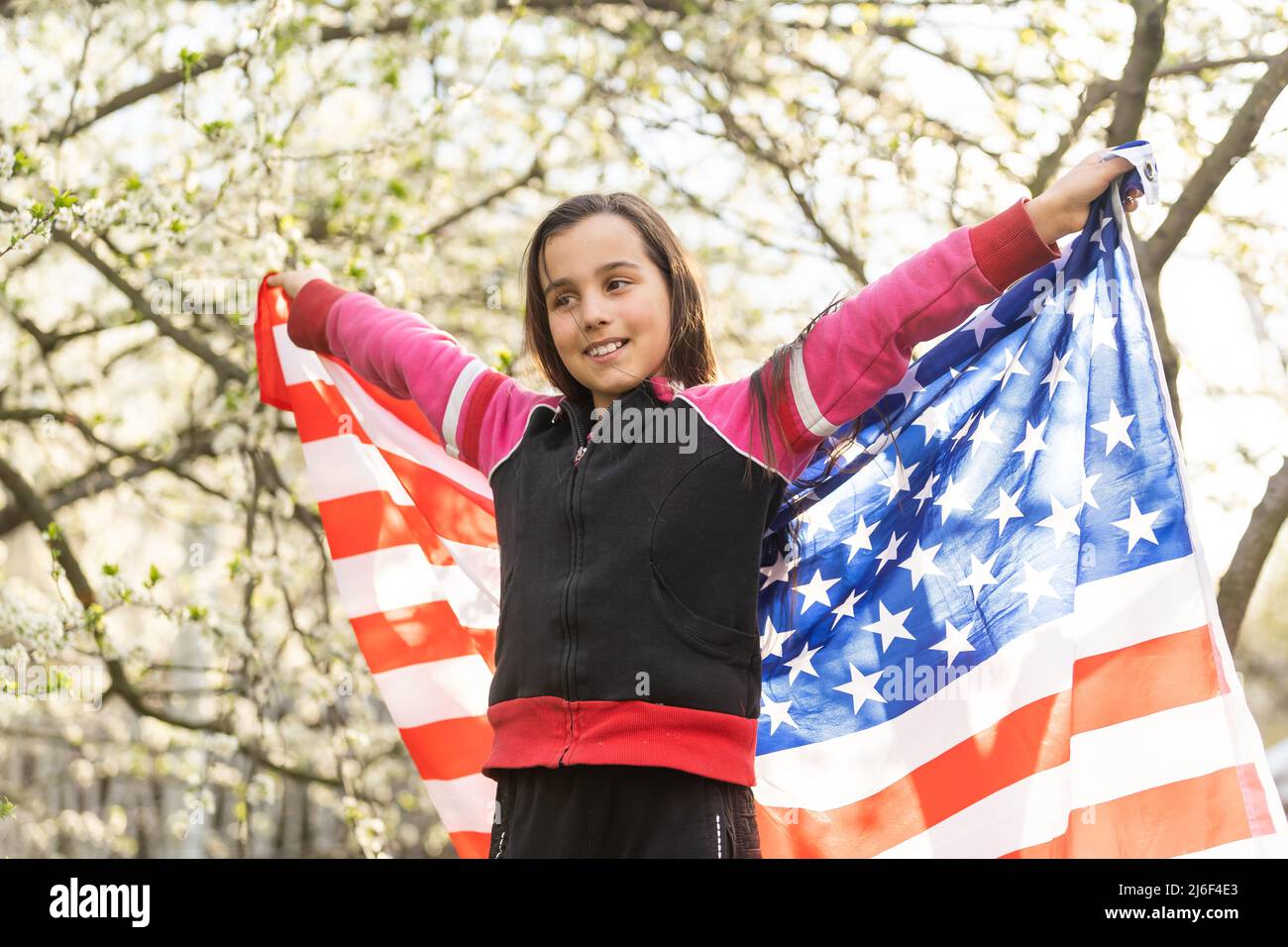 July 4th: Excited Little Girl Holding Flags Stock Photo - Alamy