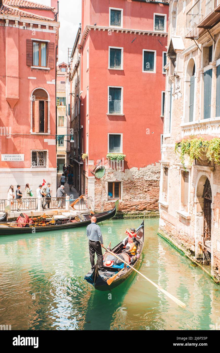 Italy, Venice - May 25, 2019: people at gondola taking tour by canal summer vacation Stock Photo ...