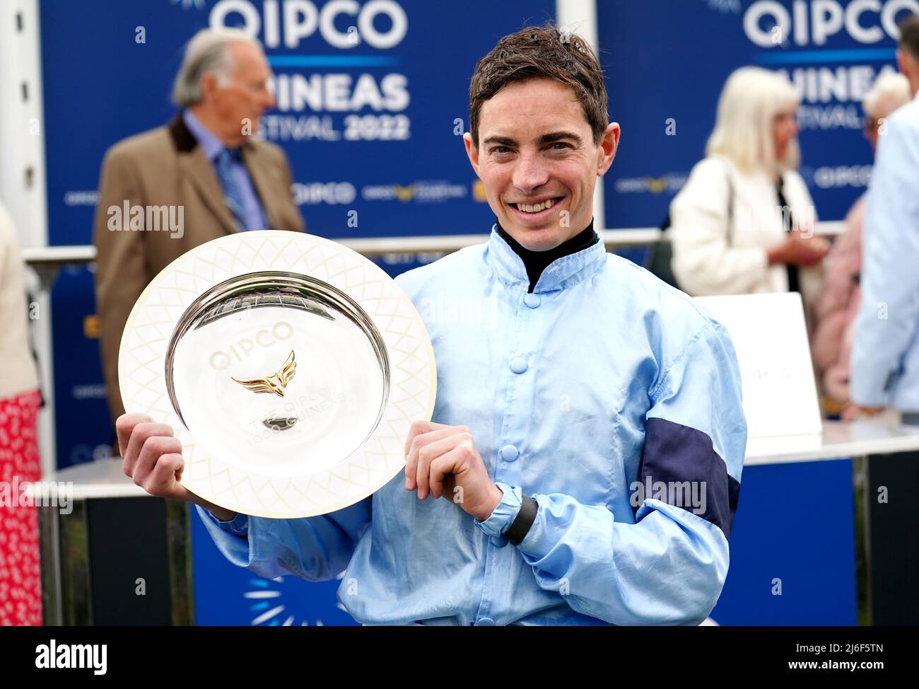Jockey James Doyle celebrates with the trophy after winning the Qipco ...