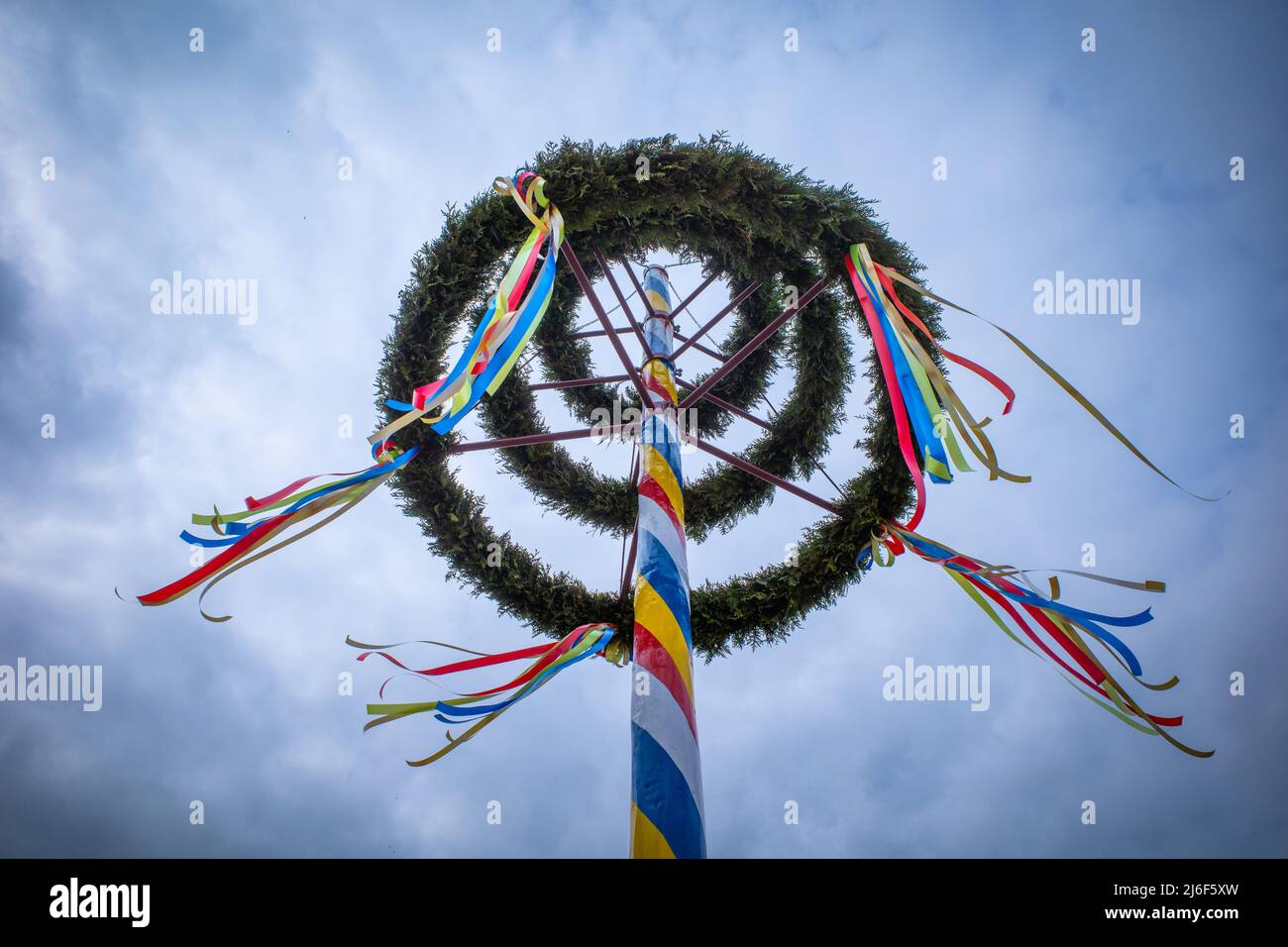 a maypole decorated with colorful ribbons Stock Photo - Alamy