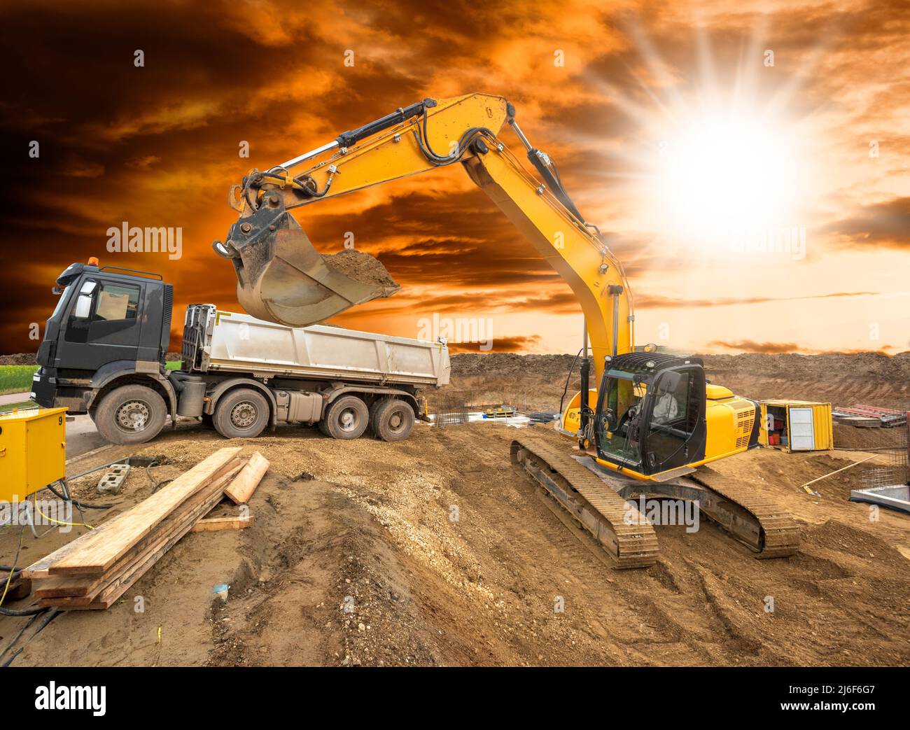 excavator is digging on construction site Stock Photo - Alamy