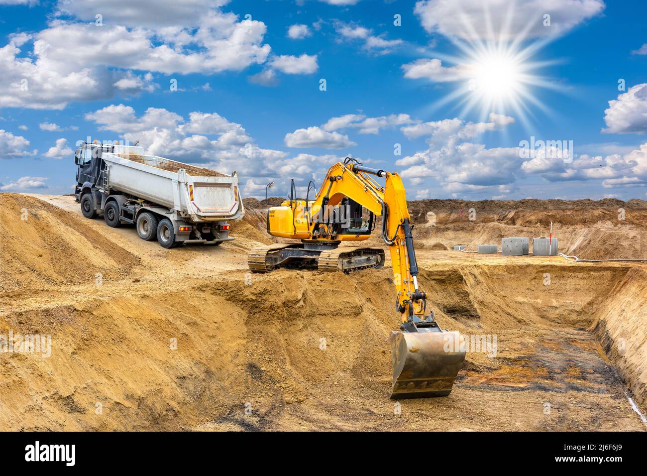 excavator is digging on construction site Stock Photo - Alamy