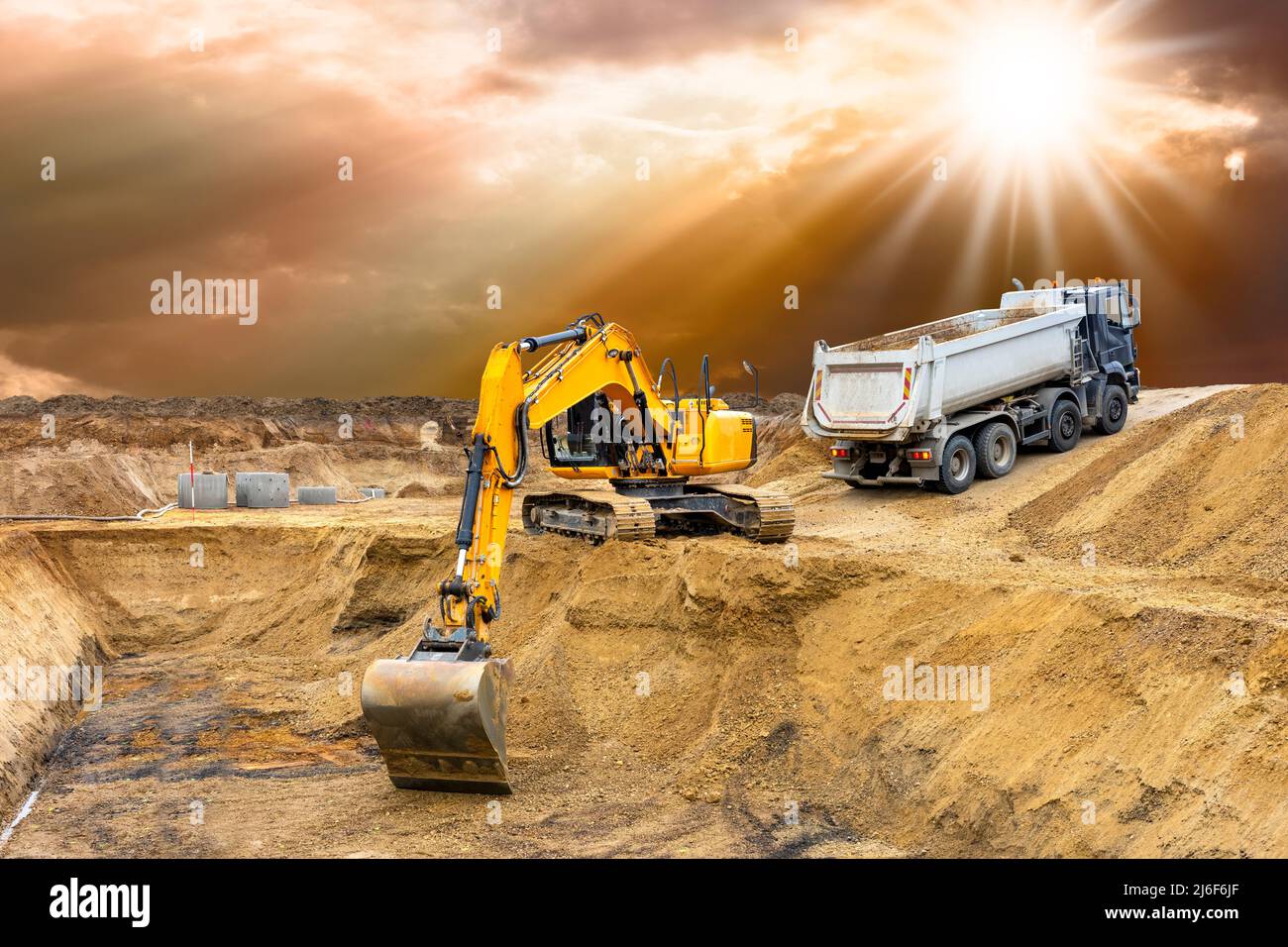 excavator is digging on construction site Stock Photo - Alamy