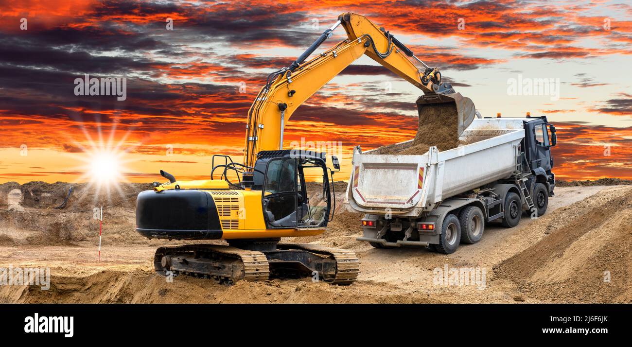 excavator is digging on construction site Stock Photo - Alamy