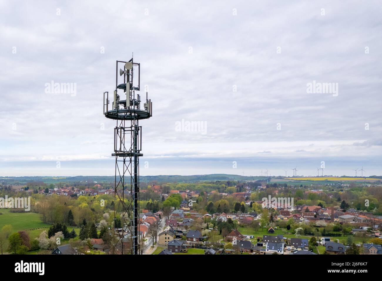 a radio mast with antennas for mobile communication is located in a ...