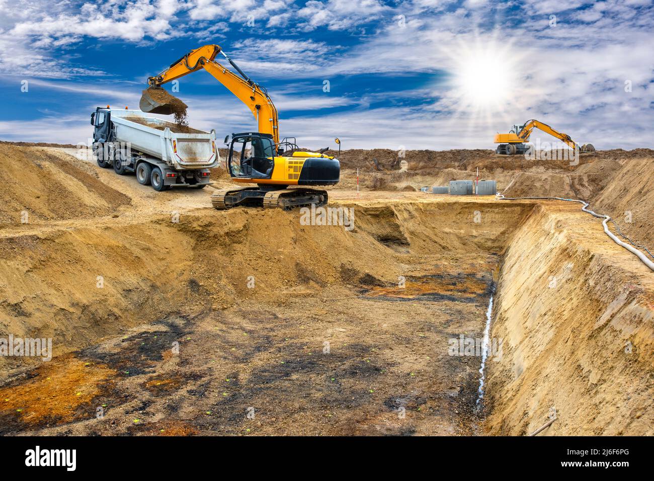 excavator is digging on construction site Stock Photo - Alamy