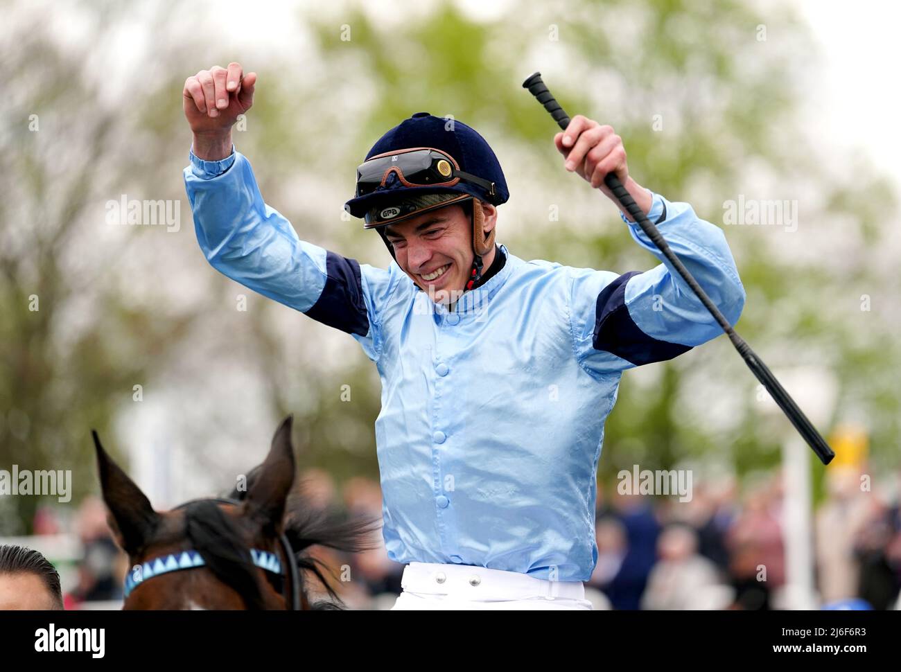 Jockey James Doyle celebrates on Cachet after winning the Qipco 1000 ...