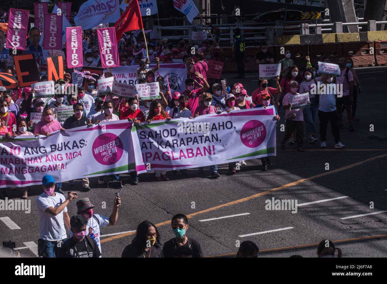 Labourers, political workers, and other sectors take part in a rally ...