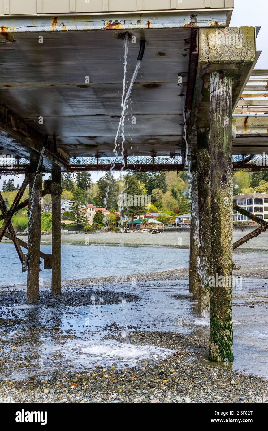 Excess water flow down from below the pier in Redondo Beach, Washington ...