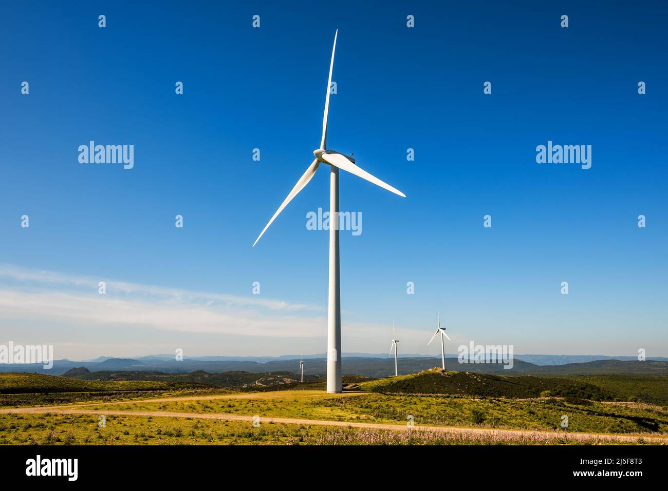 Wind turbines on a beautiful blue sky in a mountain wind farm in ...