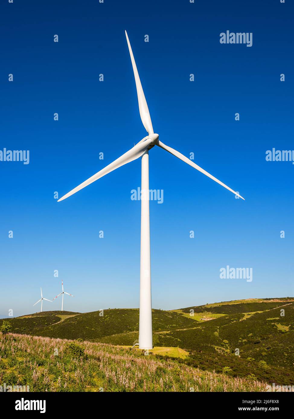 Wind turbines on a beautiful blue sky in a mountain wind farm in ...