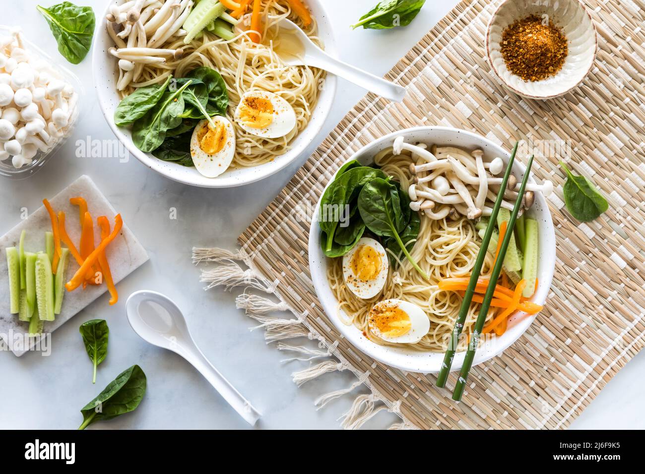 Top down view of two bowls of Vietnamese Pho soup, ready for eating ...
