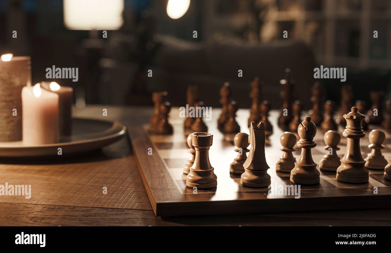 Chess pieces arranged on the chessboard in the living room, board games ...