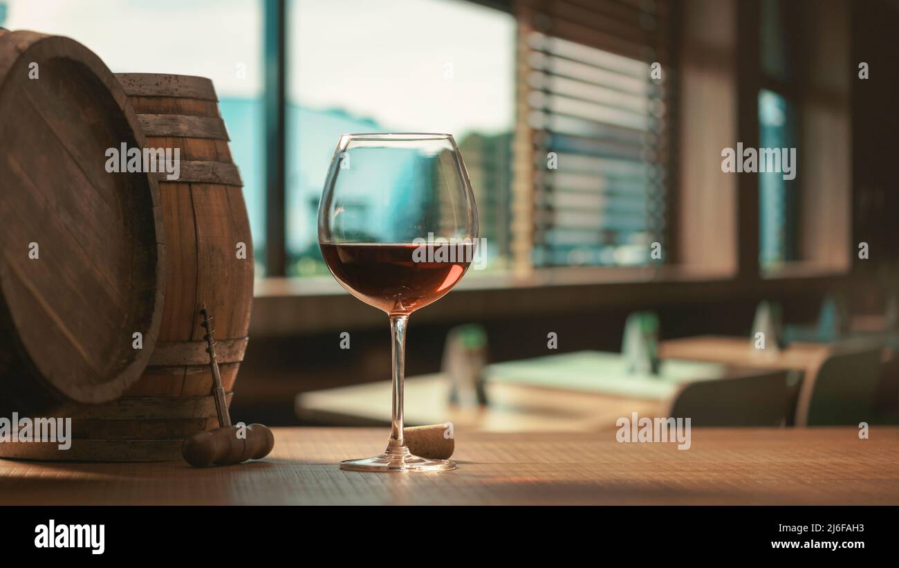 Red wine tasting: wine glass and restaurant interior in the background ...