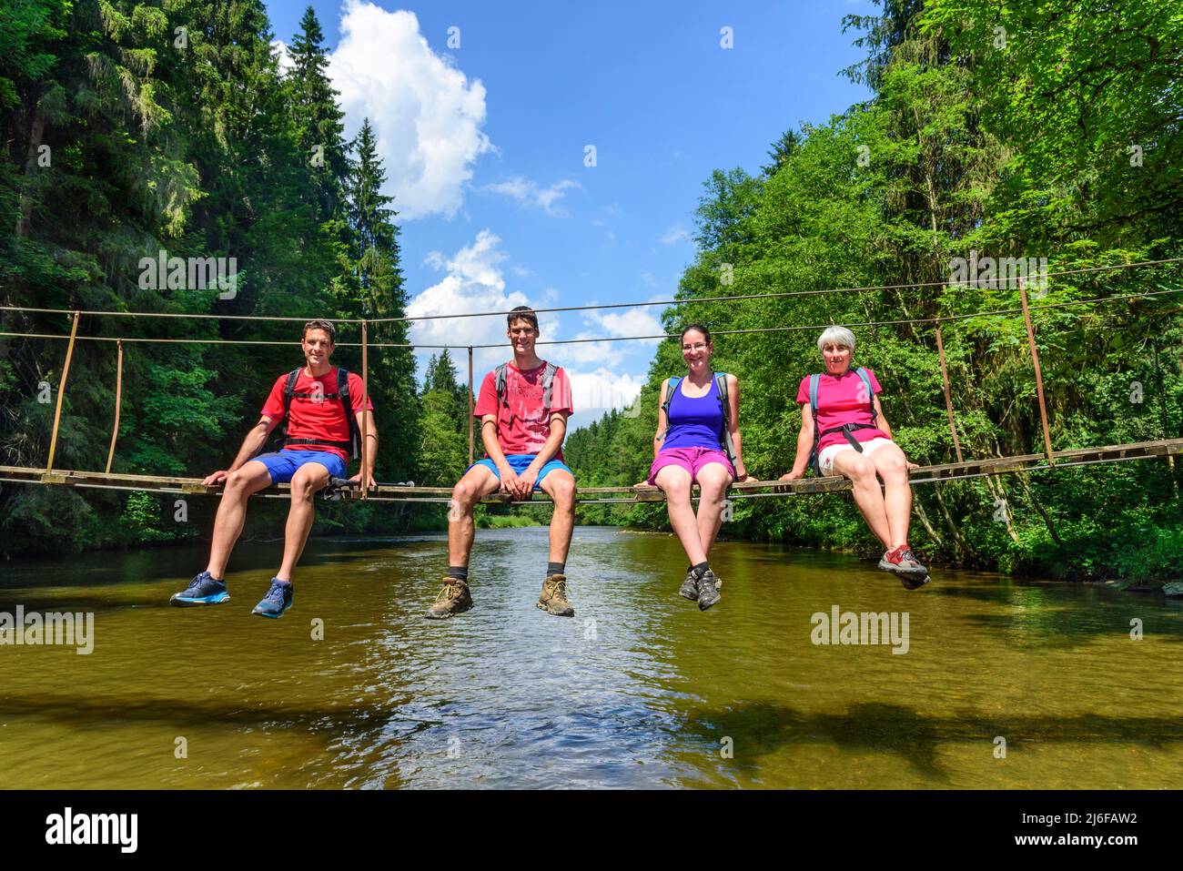 Group crossing hanging bridge hi-res stock photography and images - Alamy