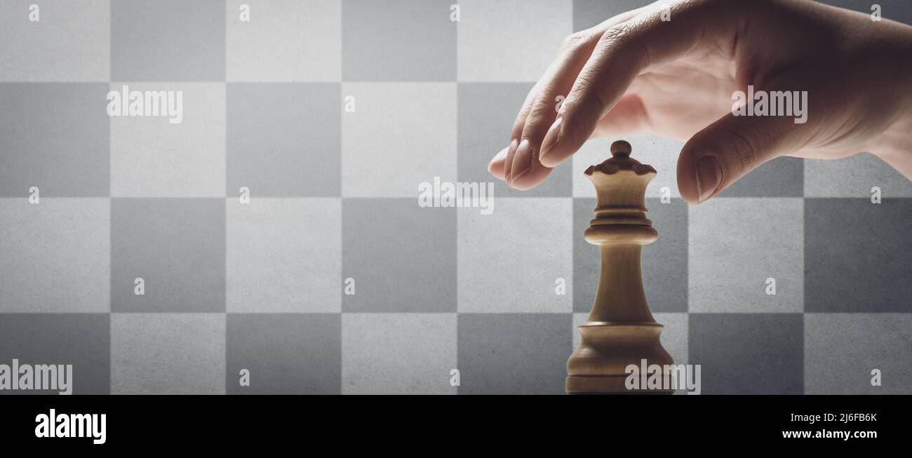 Chess player moving queen hi-res stock photography and images - Alamy