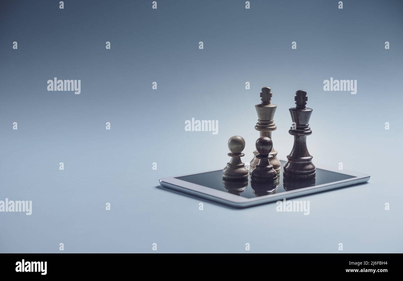 Chess pieces on a digital tablet: online chess video game concept Stock ...