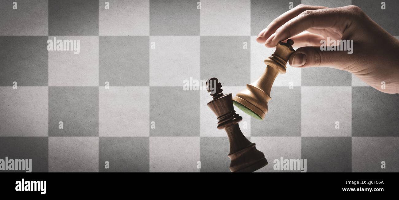 The king is checkmated and defeated, player knocking the opponent king ...