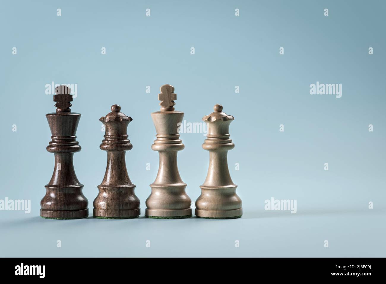 Opponent kings and queens standing in line, chess game concept, blank ...