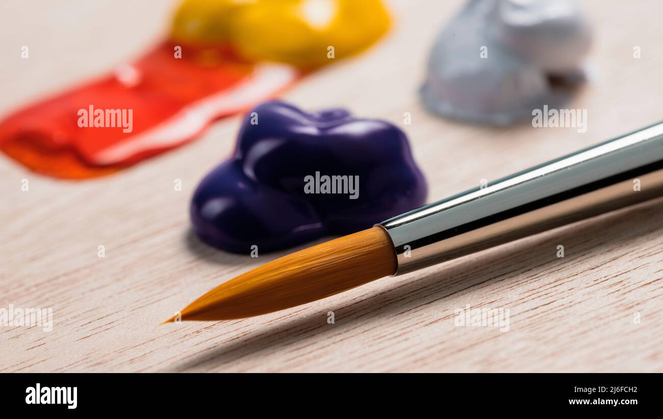 Paint brush and paint swatches on the palette, art and creativity ...