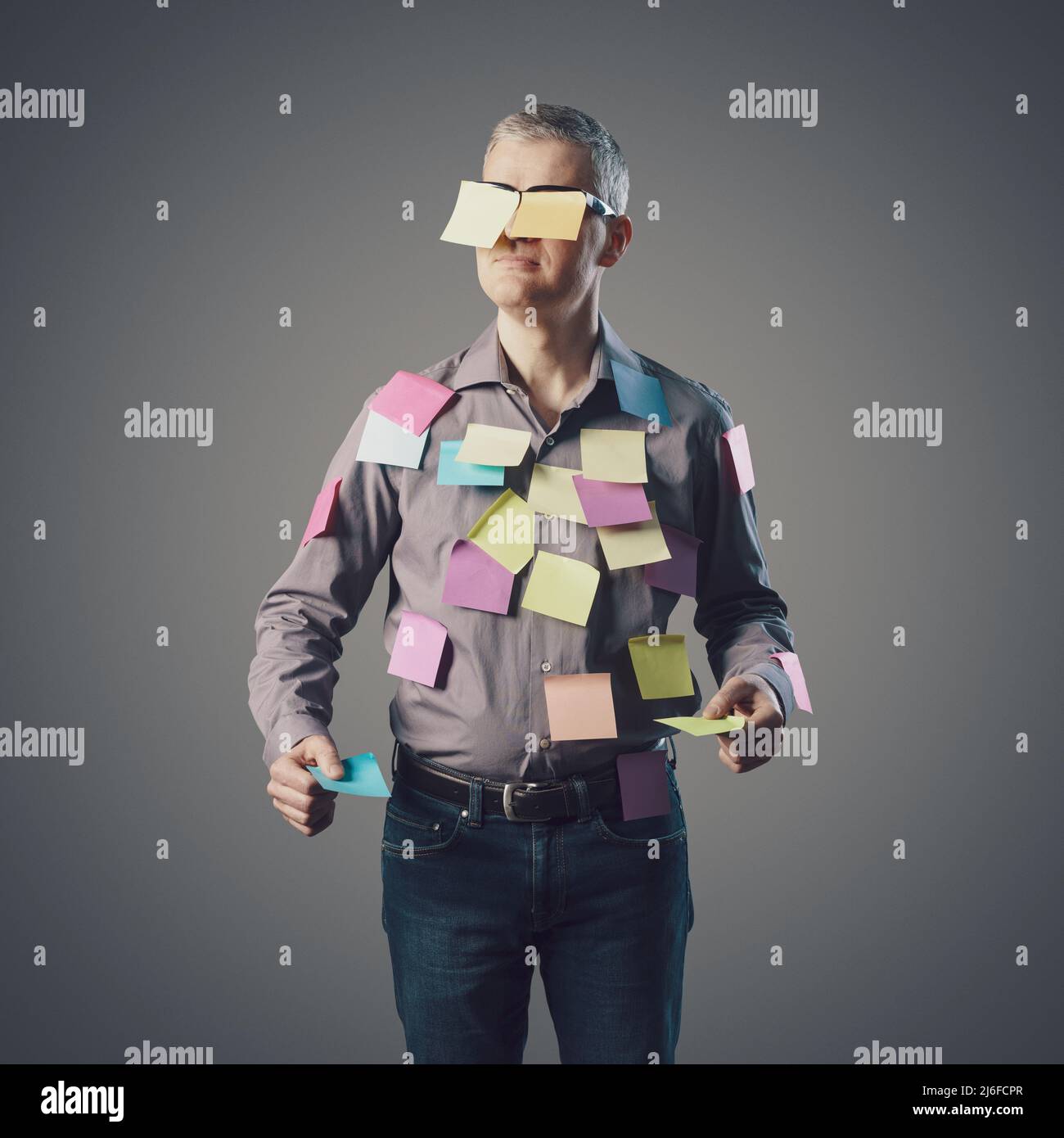 Funny man covering himself with colorful sticky notes Stock Photo - Alamy