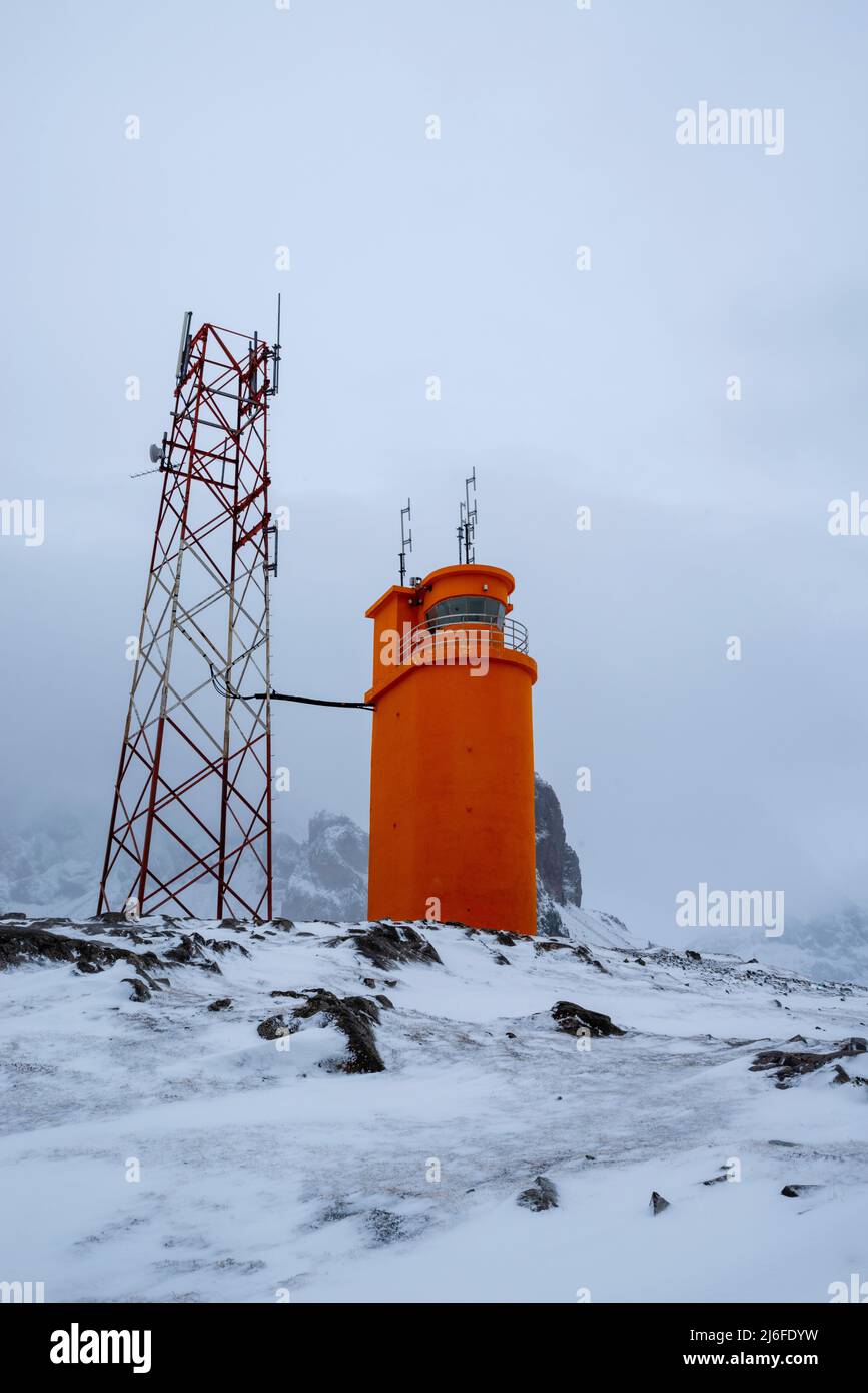 Photograph of the colorful Hvalnes Lighthouse on the southern coast of ...