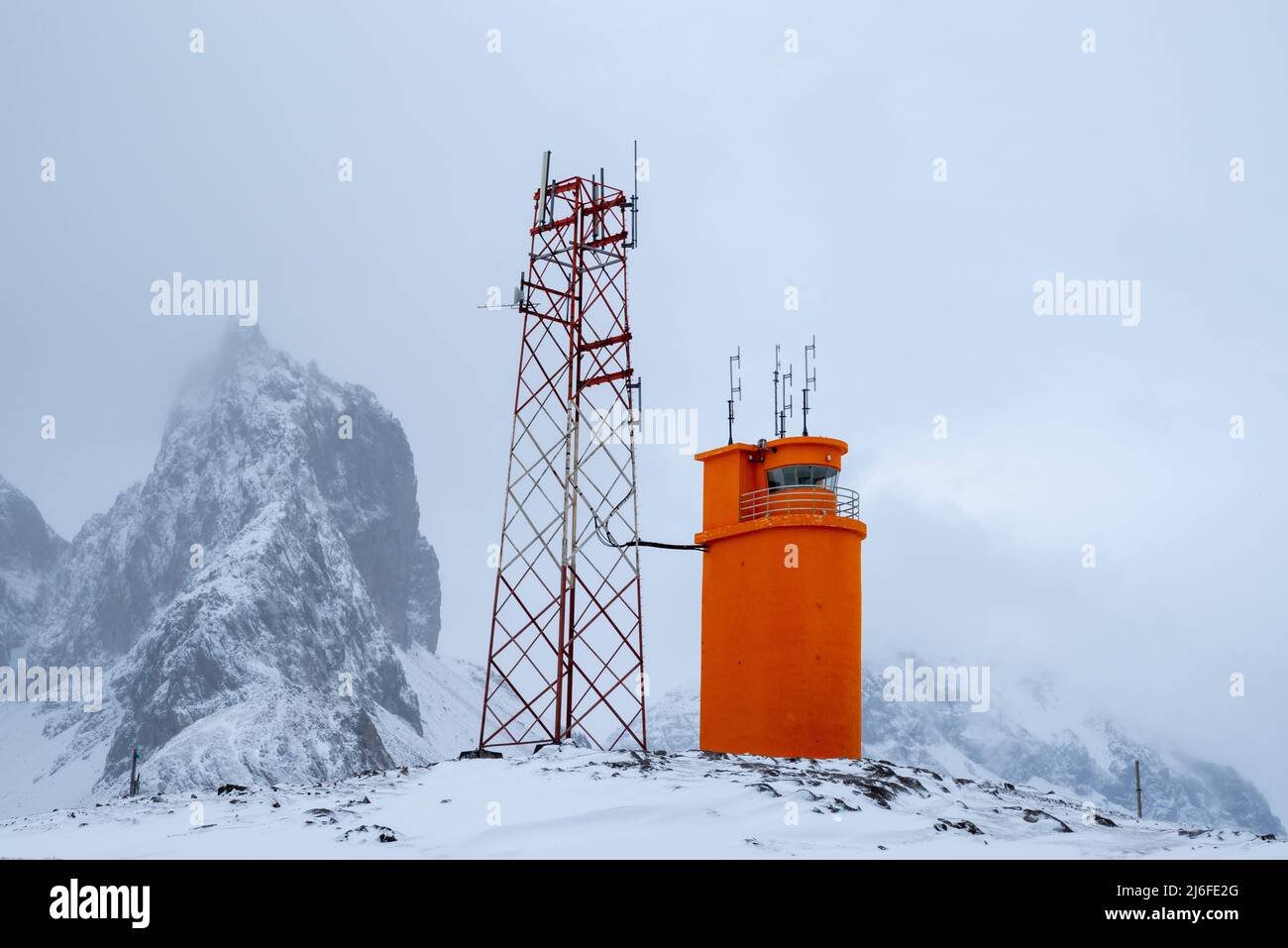 Photograph of the colorful Hvalnes Lighthouse on the southern coast of ...