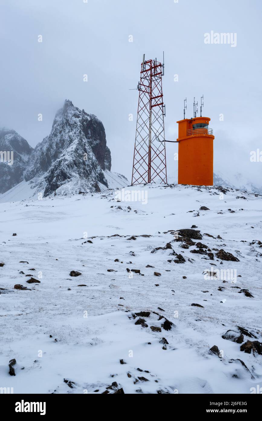 Photograph of the colorful Hvalnes Lighthouse on the southern coast of ...
