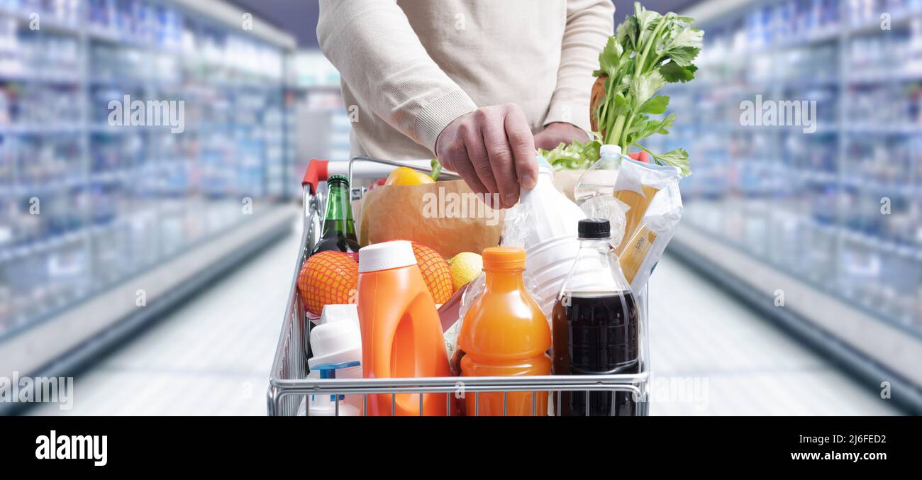 Putting milk in grocery cart hi-res stock photography and images - Alamy