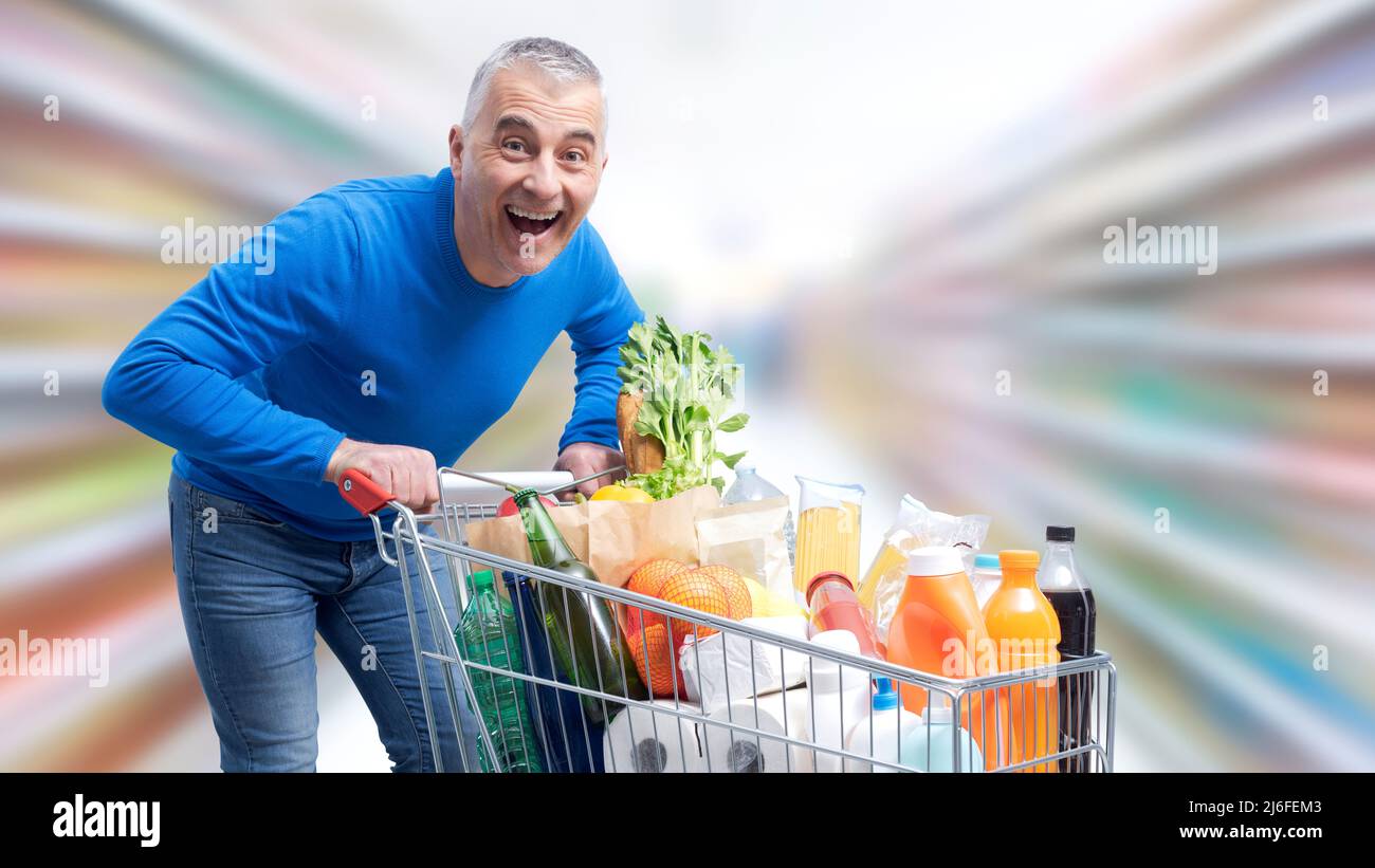 Person Pushing Full Shopping Cart