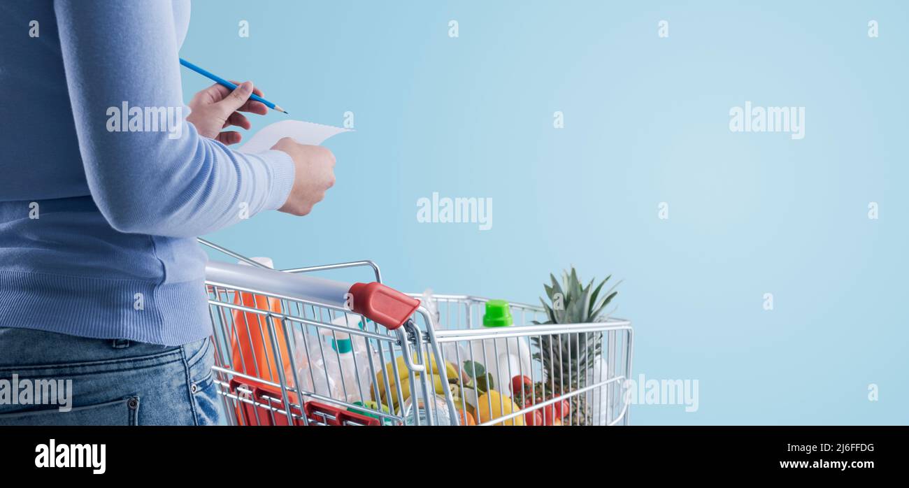 Grocery shopping list woman checking hi-res stock photography and ...
