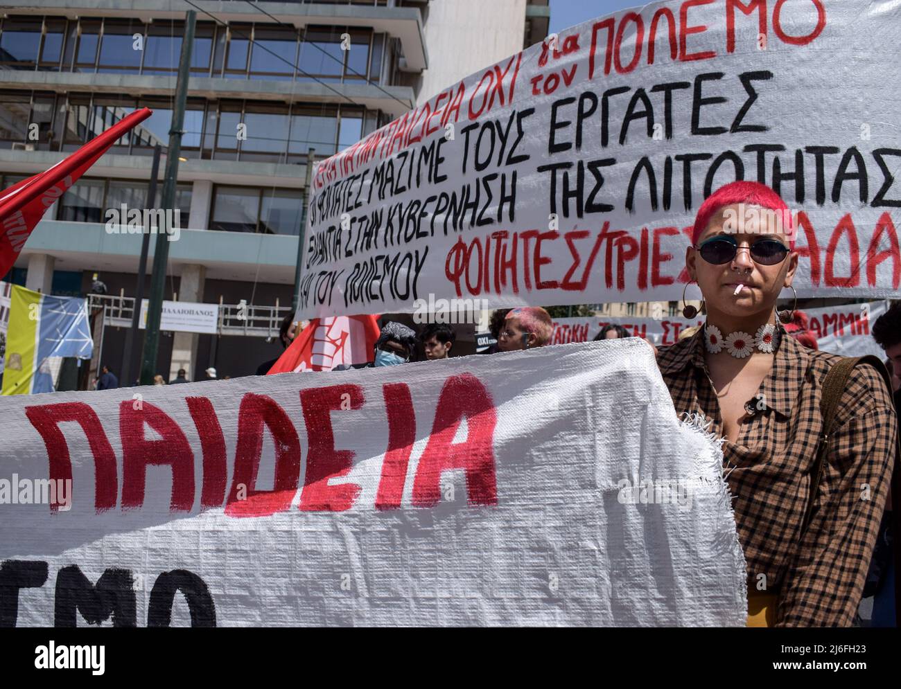 Athens, Greece. 01st May, 2022. A woman holds banner that reads ...