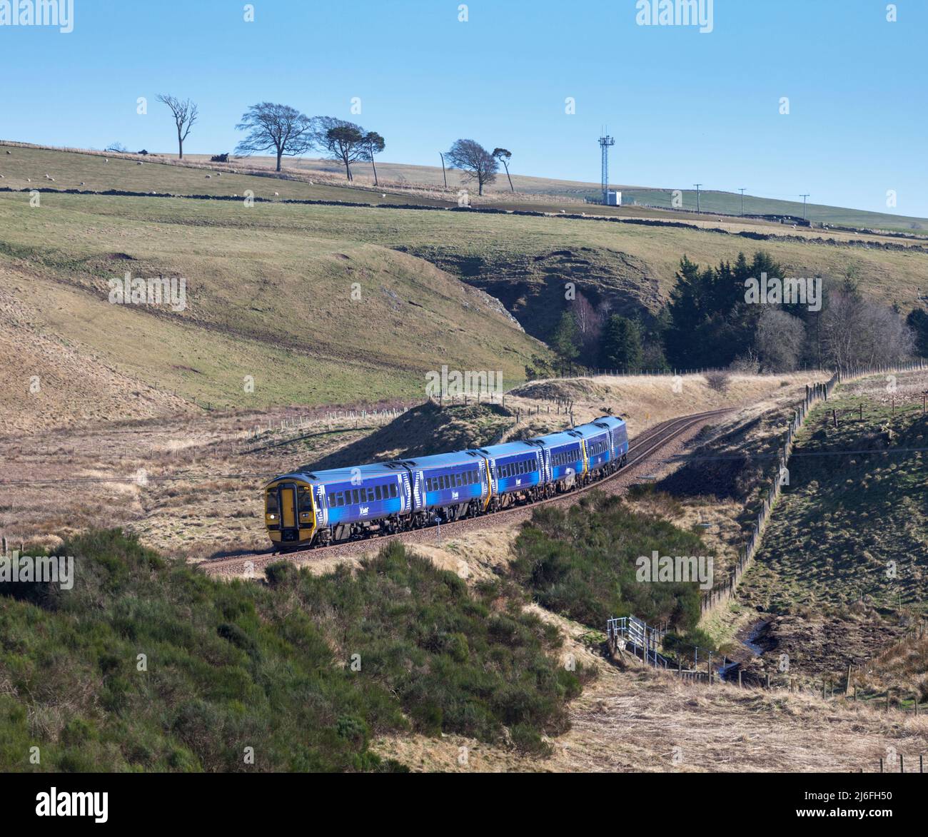 3 Scotrail class 158 DMU trains passing the countryside on the scenic ...