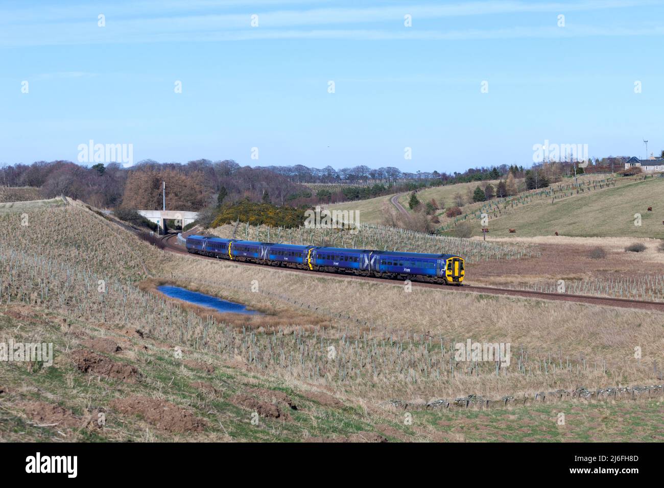 3 Scotrail class 158 DMU trains passing the countryside on the scenic ...