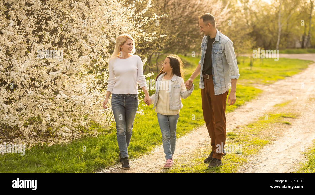 Family and child outdoors in spring nature, resting Stock Photo - Alamy