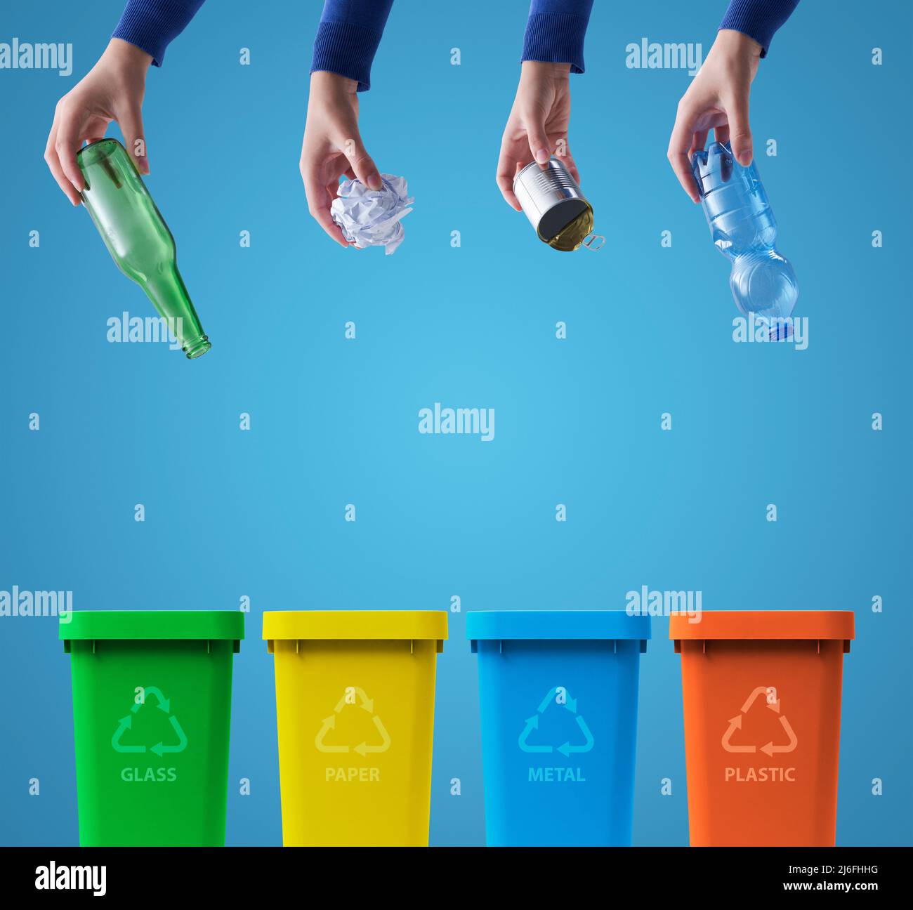 Hands putting waste in different trash bins, separate waste collection and recycling concept ...
