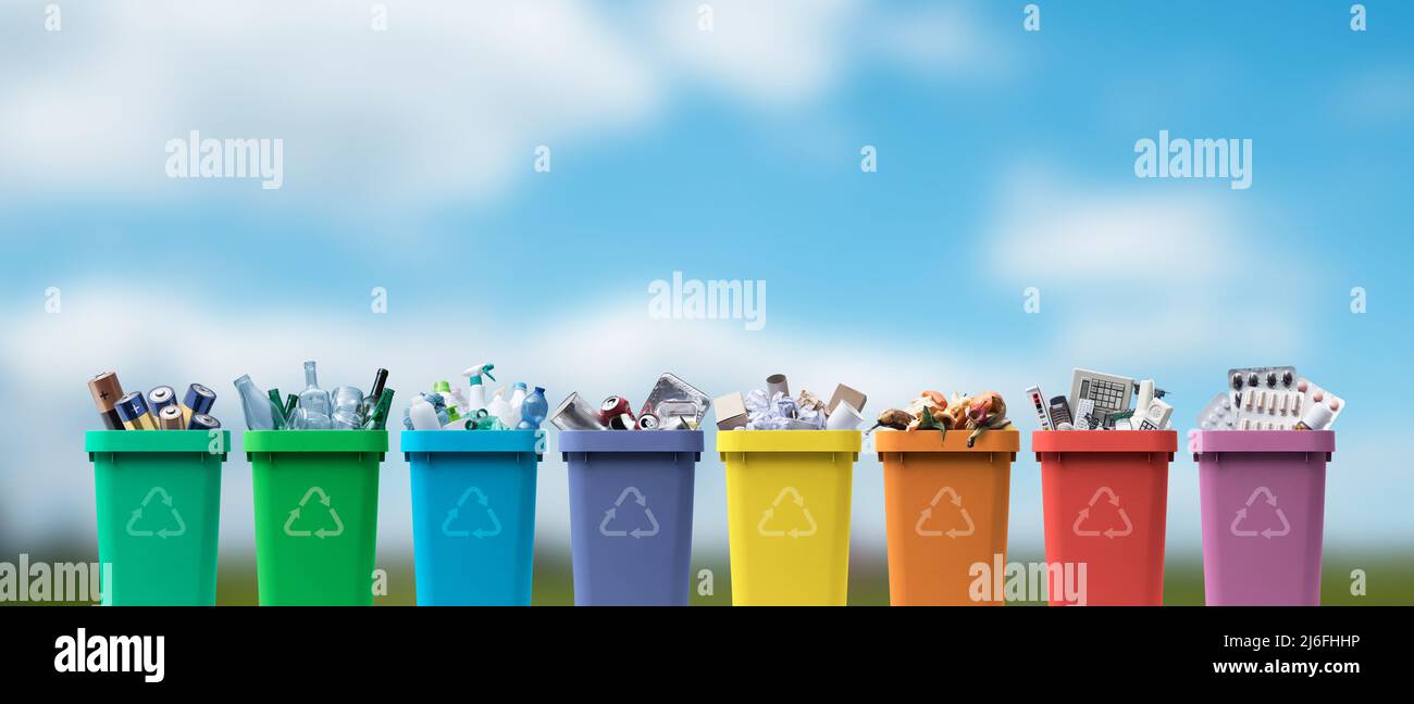 Collection of waste bins full of different types of garbage, recycling ...