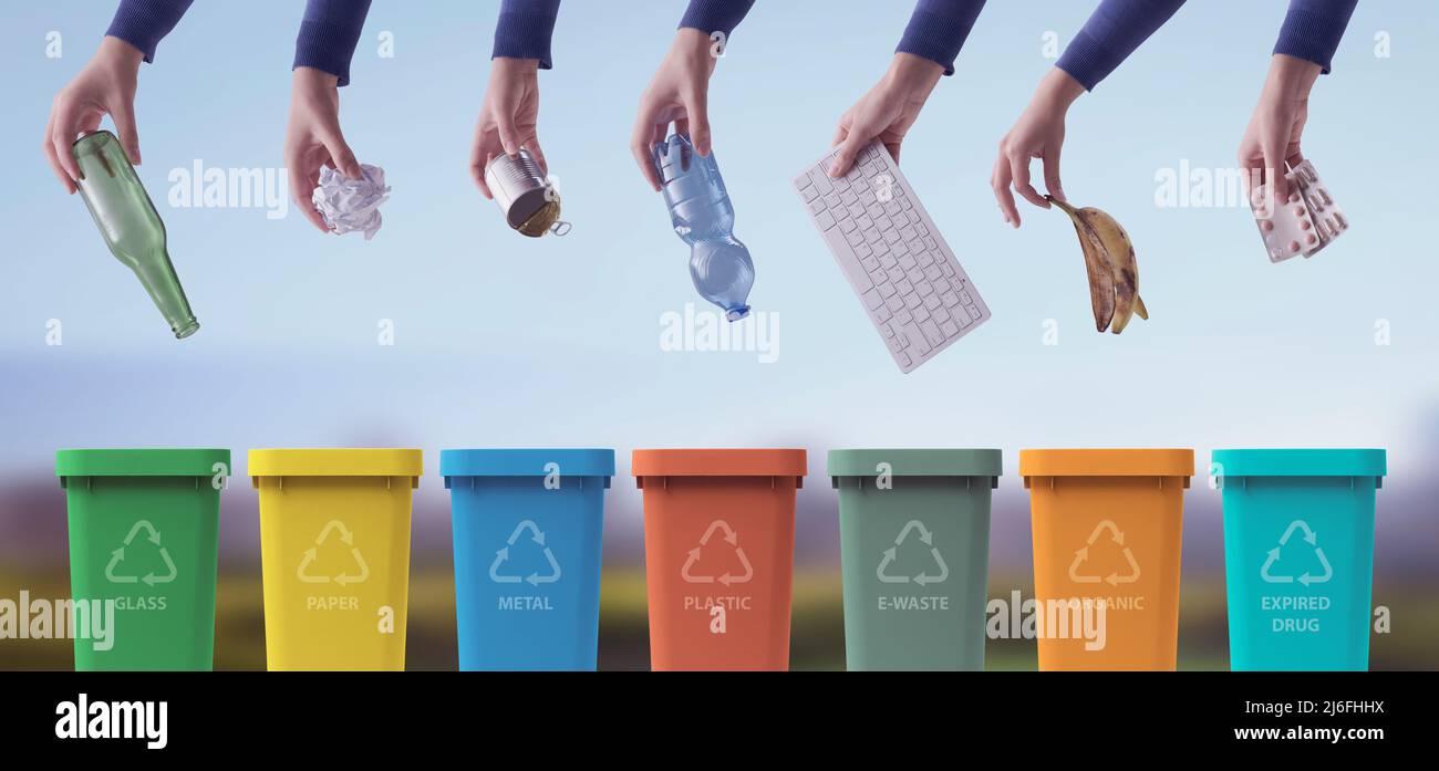Hands putting waste in different trash bins, separate waste collection ...