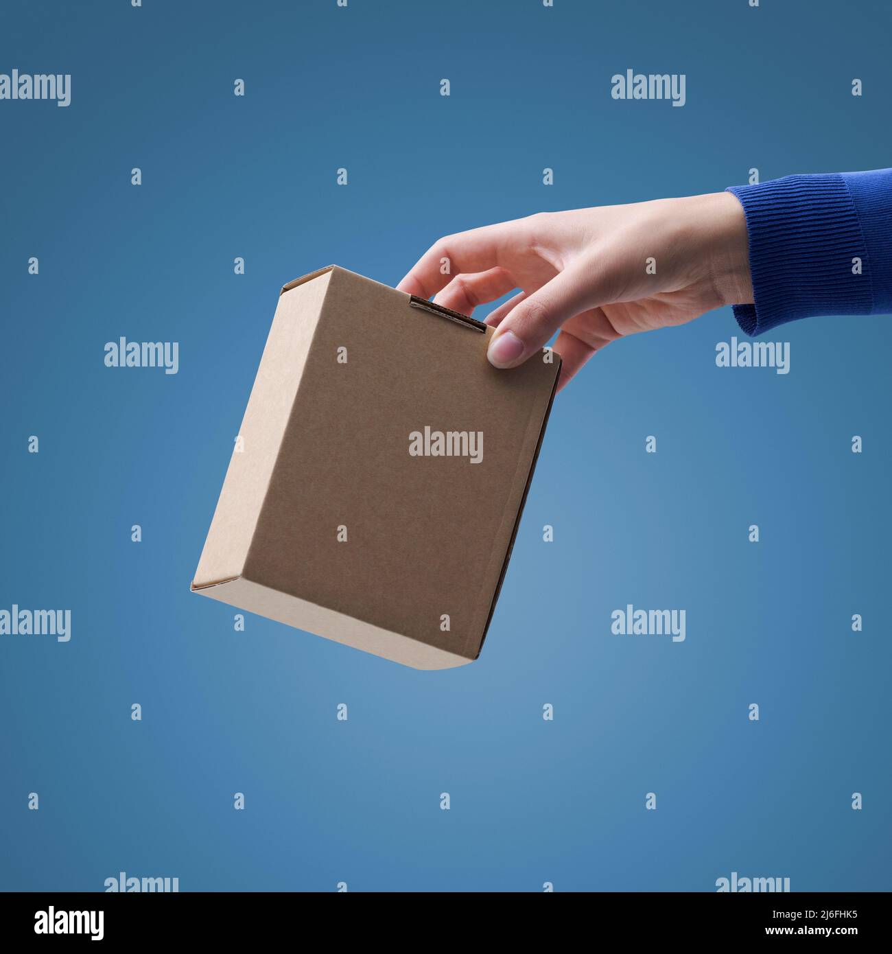 Hand holding a carton box, waste collection concept Stock Photo - Alamy