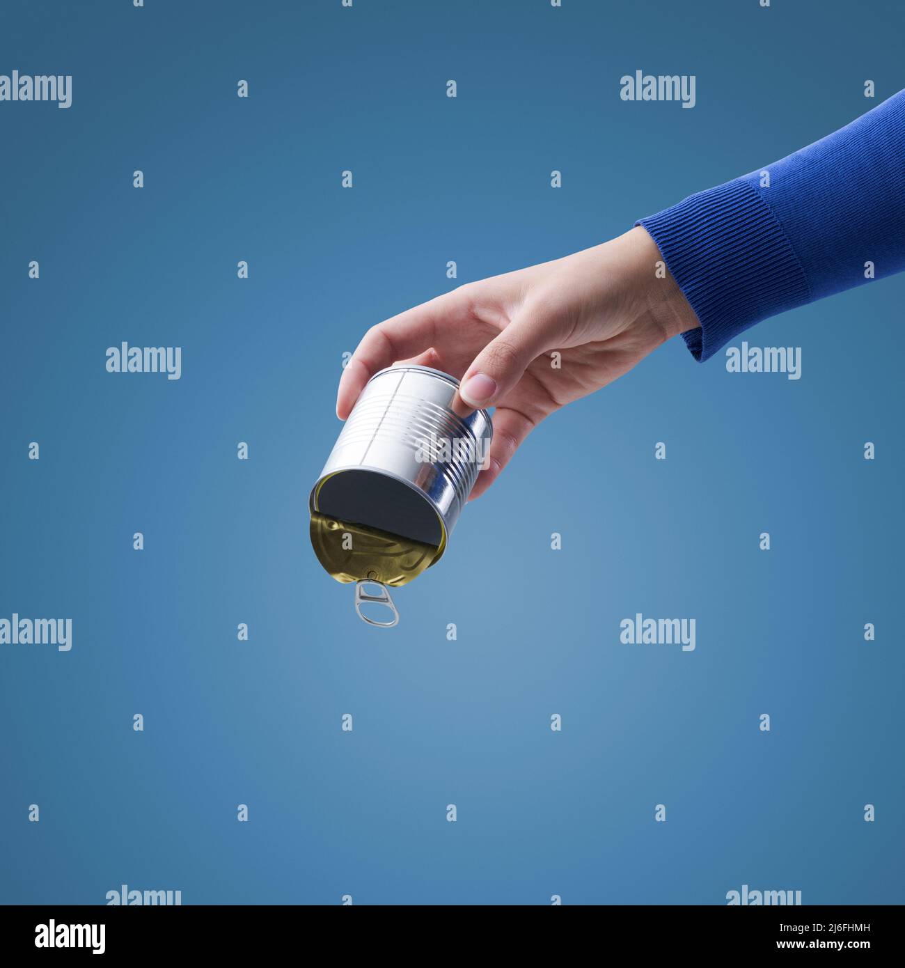 Hand holding an aluminum tin, separate waste collection and recycling ...