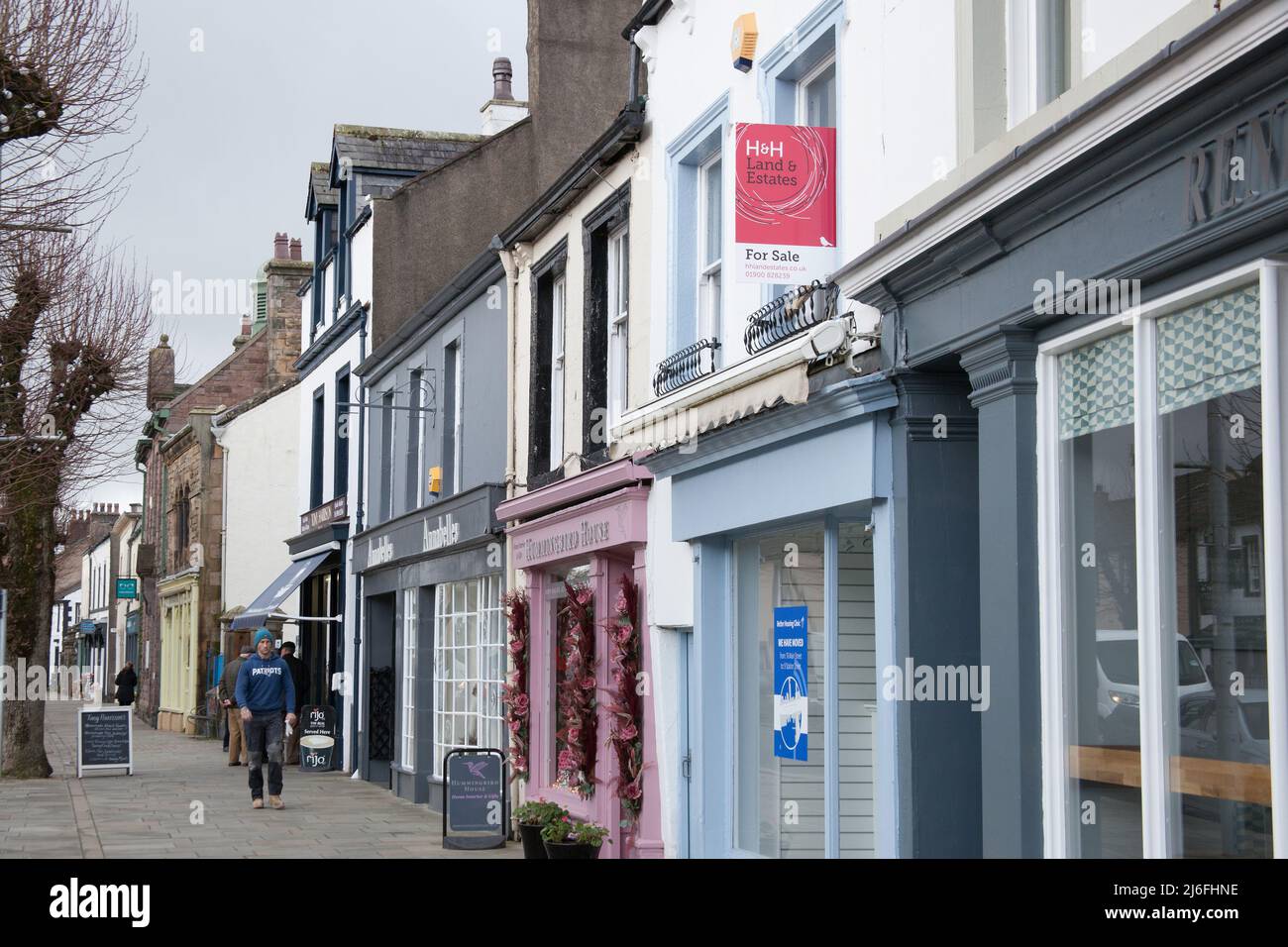 Views along Main Street in Cockermouth, Cumbria in the UK Stock Photo ...