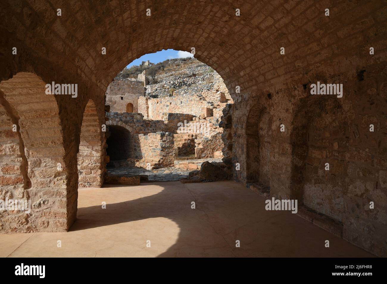 Ancient handcrafted arched stone and brick walls in the fortified town ...