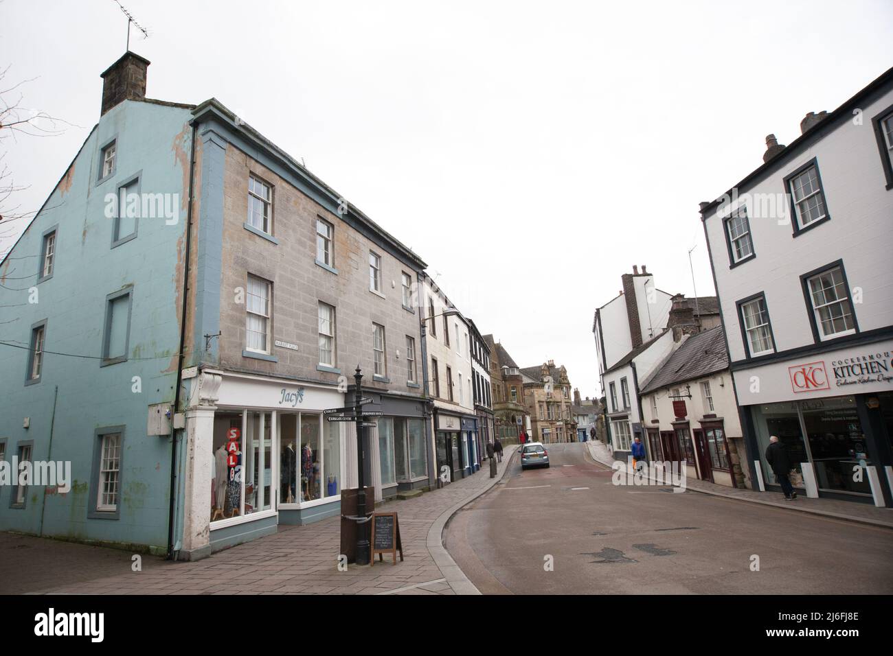 Views along Main Street in Cockermouth, Cumbria in the UK Stock Photo ...