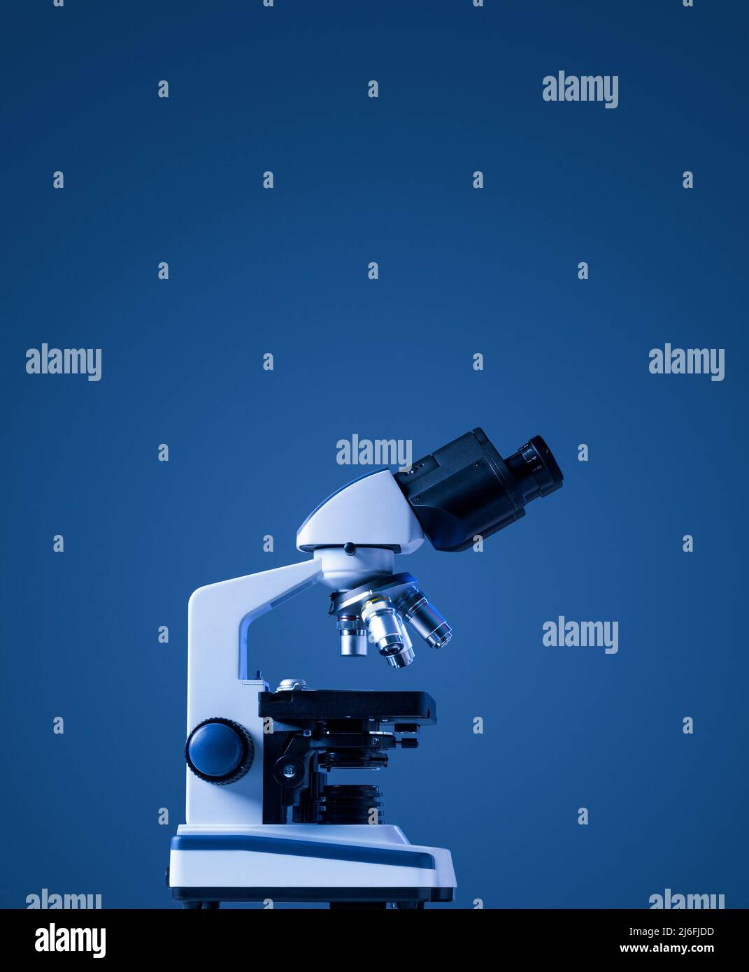 Professional laboratory microscope on blue background, science and ...
