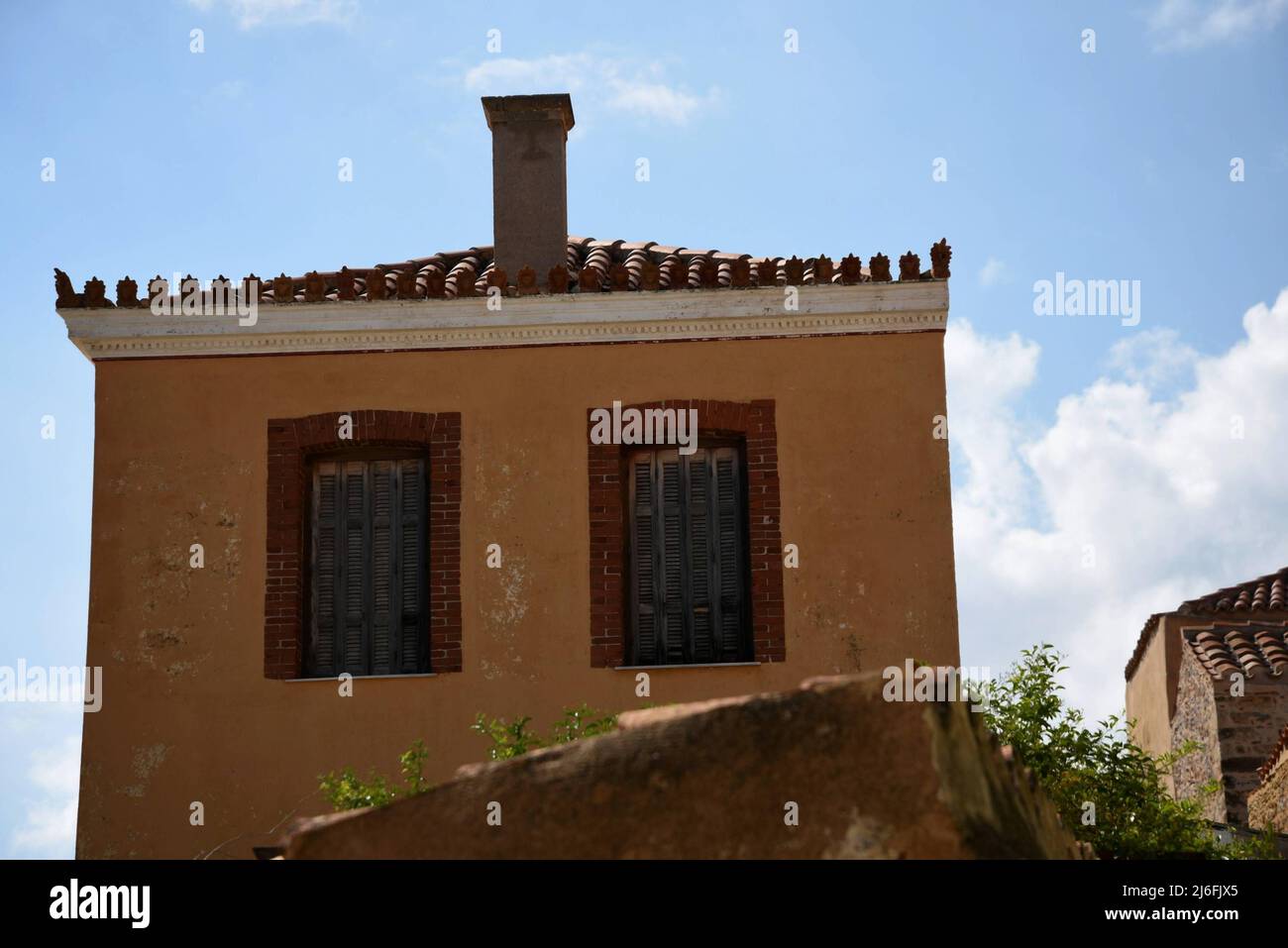 Landscape with scenic view of a typical Venetian style house with a red ...