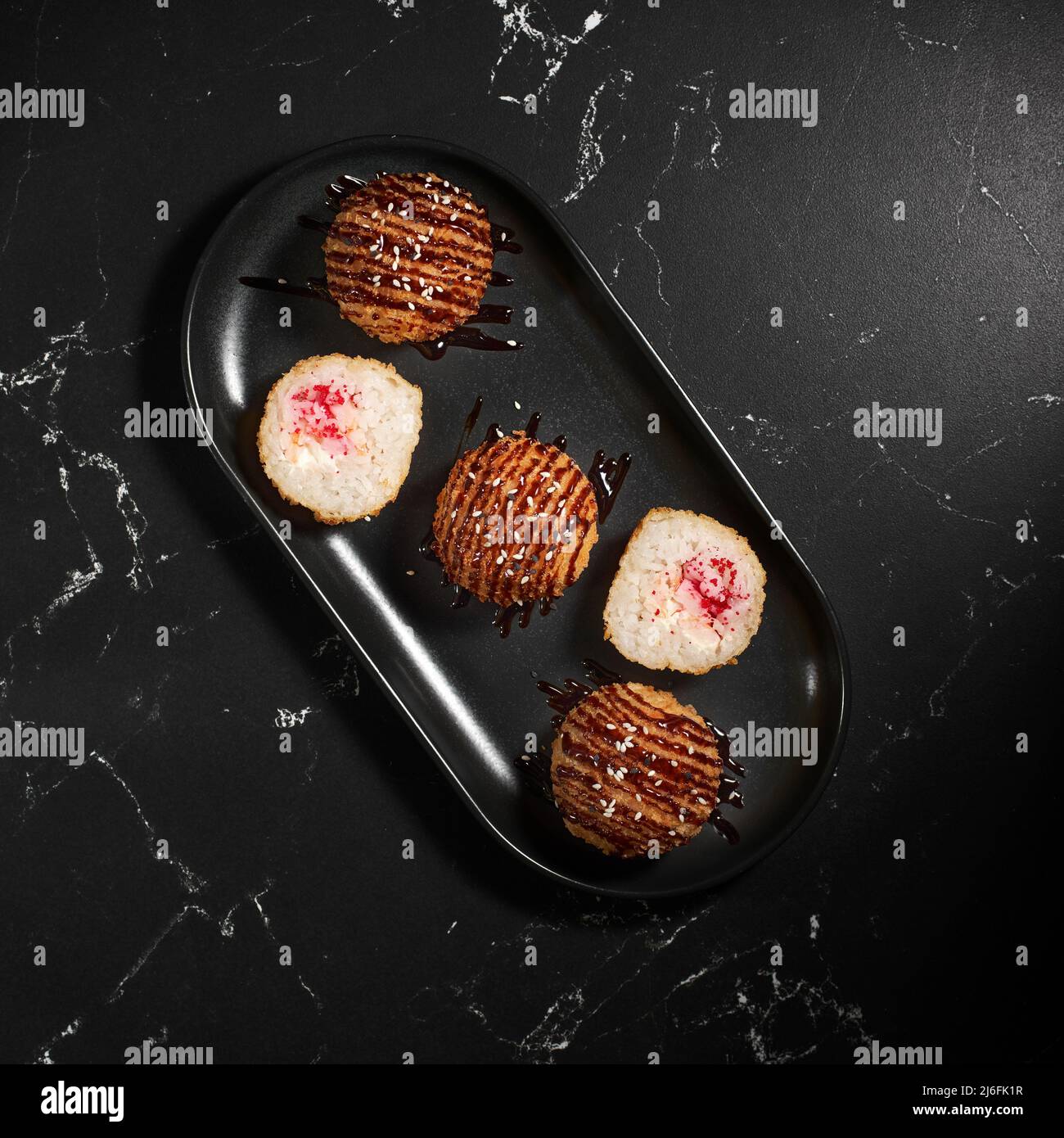 Rice croquettes with tiger shrimp. Cheese cream, tobiko caviar, tiger ...