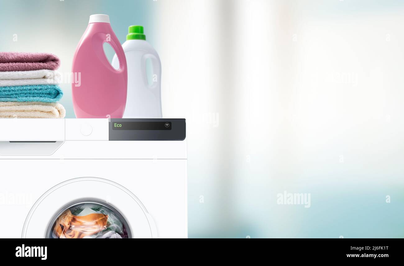 Full washing machine and laundry detergents, household chores concept ...