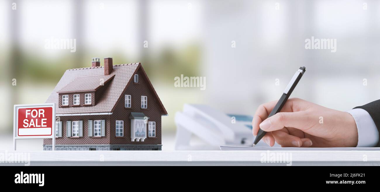 Customer signing a house purchase agreement, real estate concept Stock ...