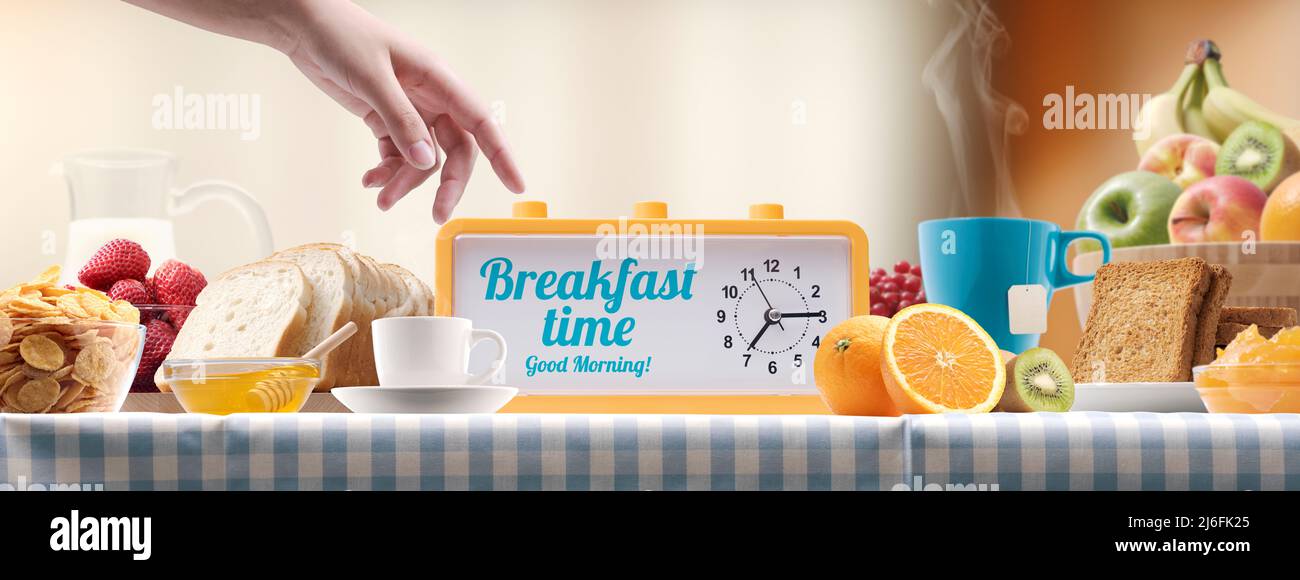 It's breakfast time: woman turning off the alarm and having a delicious ...