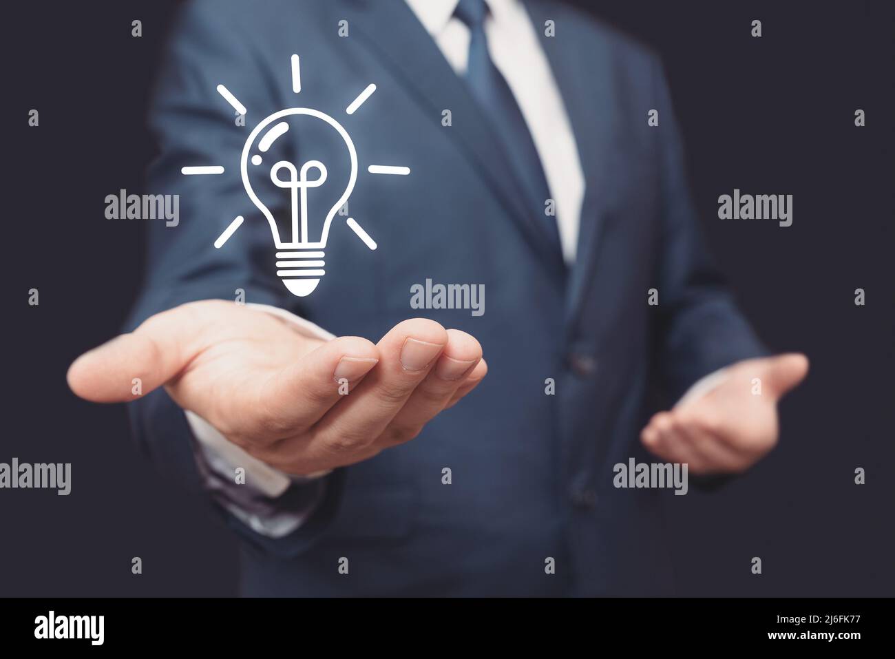 Business, creative idea concept. Businessman holding light bulb Stock Photo - Alamy